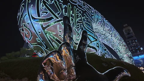 Tilt Up Shot of Famous Hand Sculpture at... | Stock Video | Pond5