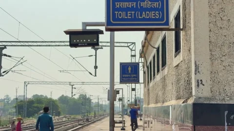 Tilt up shot shows sign board of ladies ... | Stock Video | Pond5