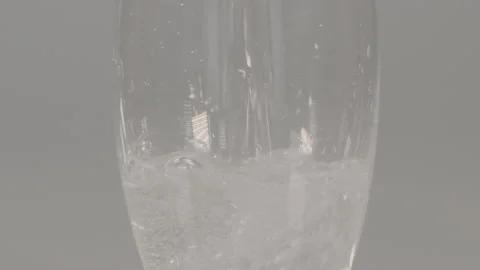 tilt up of Sparkling water being poured ... | Stock Video | Pond5