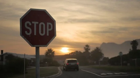 Tilt up to stop sign during sunset with ... | Stock Video | Pond5