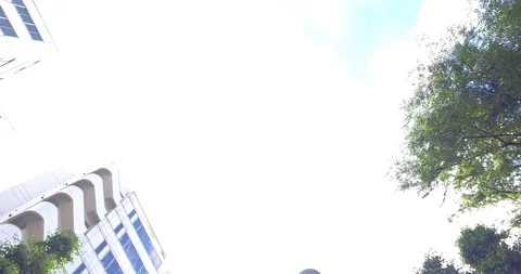 Tilt view of a shrine between buildings | Stock Video | Pond5