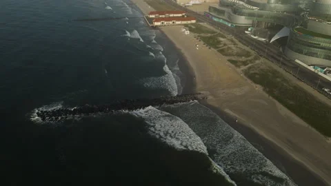 Tilt from Waves on Beach to Atlantic Cit... | Stock Video | Pond5
