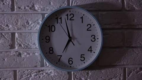 The Time On The Clock Seven. Round offic... | Stock Video | Pond5
