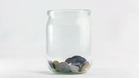 Time Lapse of Falling Coins in the Jar o... | Stock Video | Pond5