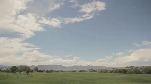 Time-lapse of a green field and people u... | Stock Video | Pond5
