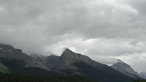 Time lapse of grey clouds moving across ... | Stock Video | Pond5