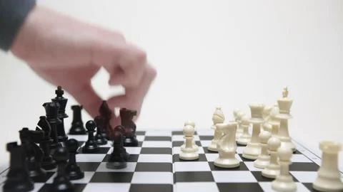 Time-lapse man playing chess game on whi... | Stock Video | Pond5