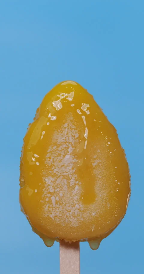 Time-lapse popsicles are melting on blue... | Stock Video | Pond5