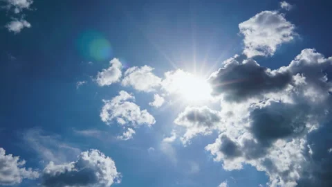 Time lapse sun and clouds moving on blue... | Stock Video | Pond5