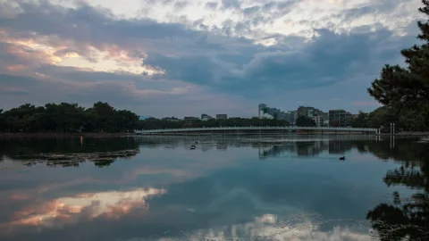 Time lapse: Sunset clouds move over pede... | Stock Video | Pond5
