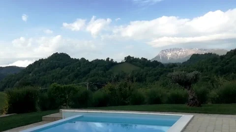 Time lapse with swimming pool, mountains... | Stock Video | Pond5