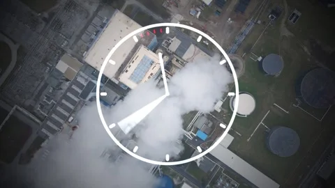 Time to reduce CO2 emissions, clock over... | Stock Video | Pond5