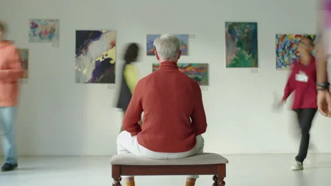 Timelapse of Man Sitting in Art Gallery | Stock Video | Pond5