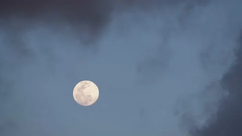 Timelapse Shot of a Full Moon Rising in ... | Stock Video | Pond5