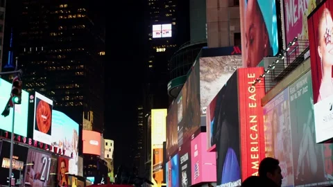 Times Square commercials on huge display... | Stock Video | Pond5