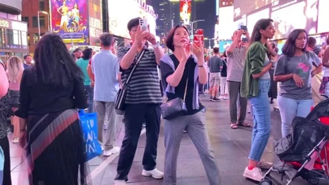 Times Square at night, crowd of people o... | Stock Video | Pond5