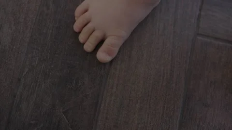tiny barefoot legs doing first steps, le... | Stock Video | Pond5