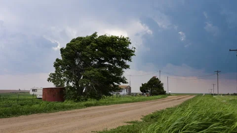 Tiny House On Dusty Road With Stormy Sky... | Stock Video | Pond5