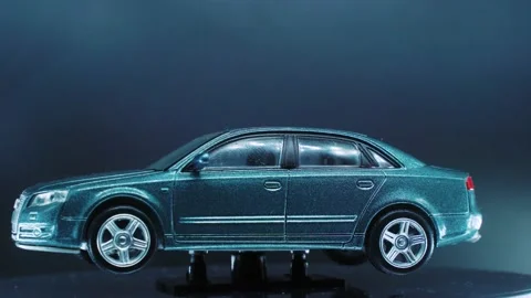 A tiny model metal sample car on a rotat... | Stock Video | Pond5