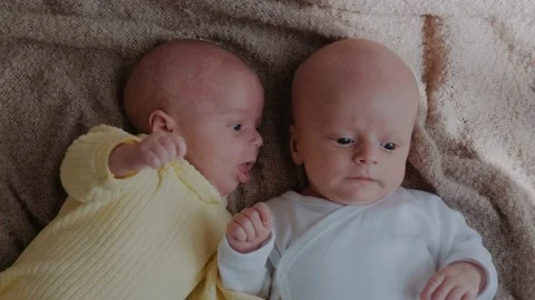 Tiny newborn twins babies. boy and girl ... | Stock Video | Pond5