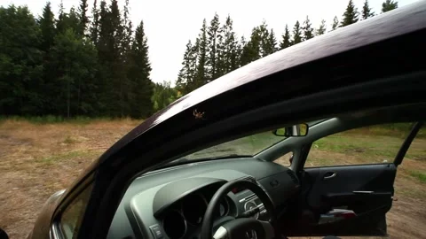 Tiny spider crawling over a car with ope... | Stock Video | Pond5