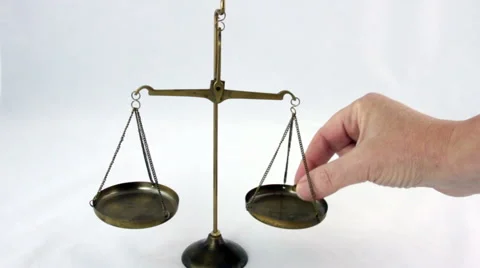 Tipping the scales | Stock Video | Pond5