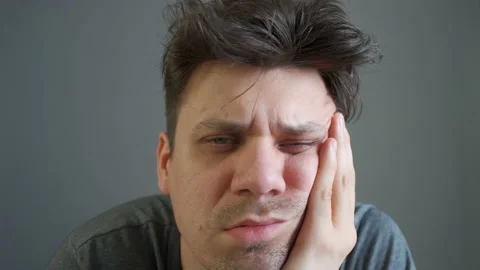 Tired boring shaggy young man is looking... | Stock Video | Pond5