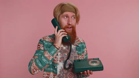 Tired crazy hippie man talking on wired ... | Stock Video | Pond5