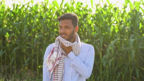 Tired indian farmer on his corn field | Stock Video | Pond5