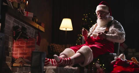 Tired Santa Claus sleeping near fireplac... | Stock Video | Pond5