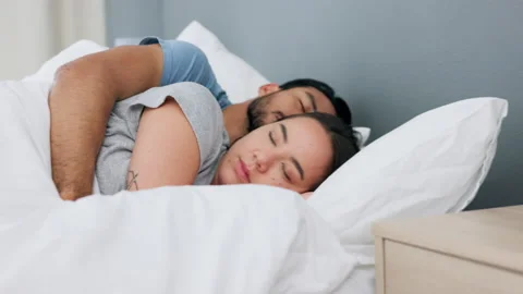 Tired, sleeping and hug couple in a bed ... | Stock Video | Pond5