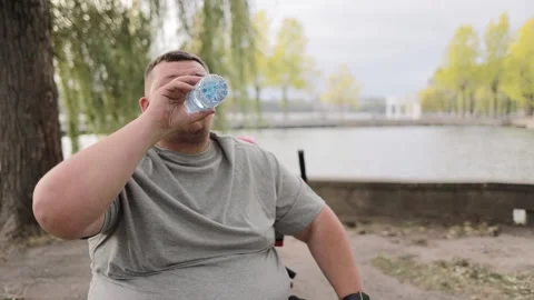 Fat Man Drinking Water Stock Footage ~ Royalty Free Stock Videos | Pond5