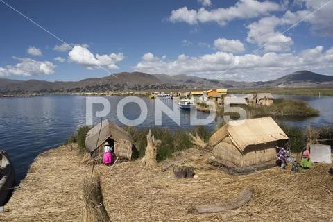 Titicaca lake, island floating,,totorara ,canoe ,house indigenous ,puno ...
