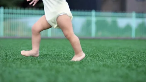 Toddler legs learning to walk with bare ... | Stock Video | Pond5
