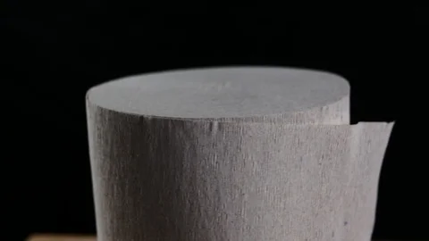 Toilet paper roll rotating on black back... | Stock Video | Pond5