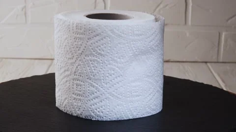 Toilet paper roll rotating on a black ba... | Stock Video | Pond5