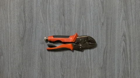 Tools being placed in frame by hand with... | Stock Video | Pond5