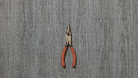 Tools being placed in frame by hand with... | Stock Video | Pond5