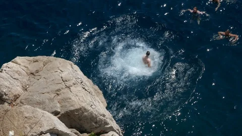 Top aerial view of a young man jumping i... | Stock Video | Pond5