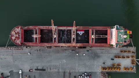 Top down aerial of cargo ship at harbor ... | Stock Video | Pond5