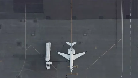 Top down aerial of private jet getting f... | Stock Video | Pond5