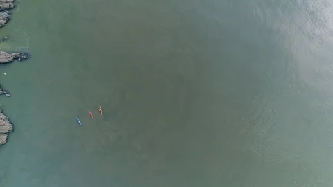 Top down aerial on three people in kayak... | Stock Video | Pond5