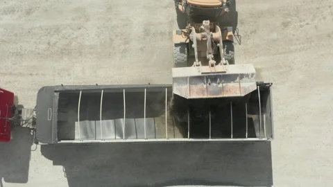 Top-Down Aerial View of Front Loader Pou... | Stock Video | Pond5