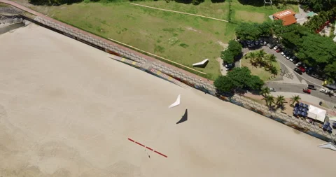 Top down aerial view of hang glider land... | Stock Video | Pond5