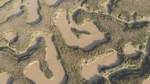 Top down and reveal shot Tollesbury mars... | Stock Video | Pond5