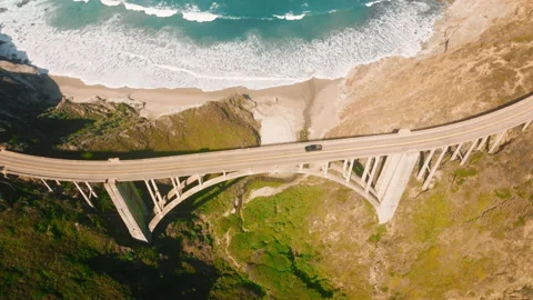 Top down car driving by scenic arch arch... | Stock Video | Pond5