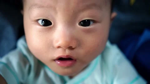 Top down view baby boy eye with expressi... | Stock Video | Pond5