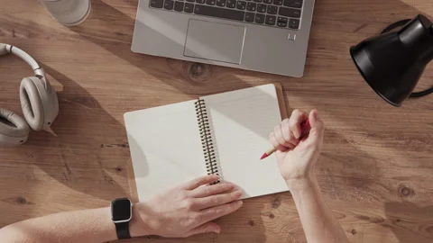 Top down view of girl open her notebook ... | Stock Video | Pond5