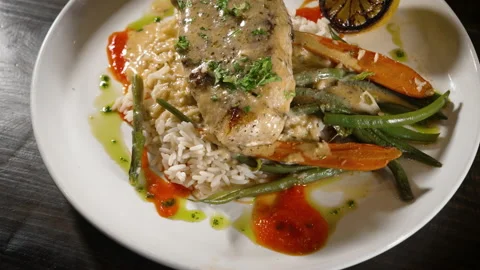 Top down view grilled white fish over ri... | Stock Video | Pond5