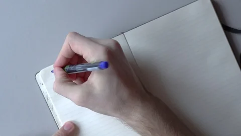 Top down view of male adult writing to d... | Stock Video | Pond5